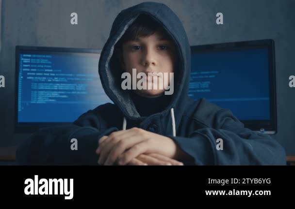 Portrait of Wanted Prodigy Boy Hacker in the data center filled with ...