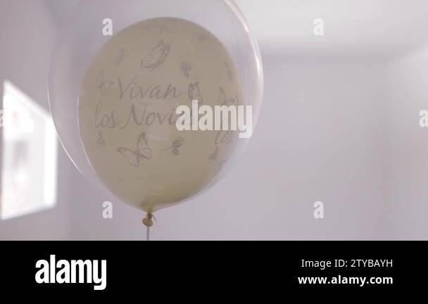 White balloon inside a transparent balloon with message for wedding ...