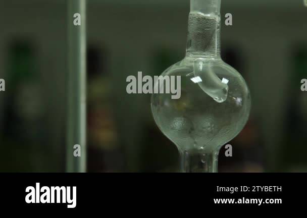 The process of solution boiling in a flask in a chemical laboratory ...