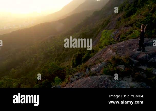 Silhouette of people rejoicing and lifting up his hands to celebrate ...