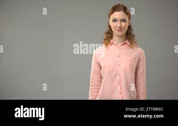 Lady saying happy new year in sign language, female teacher showing ...