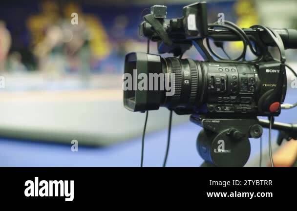 Cameraman with a camera in wrestling competitions. Close-up Stock Video ...