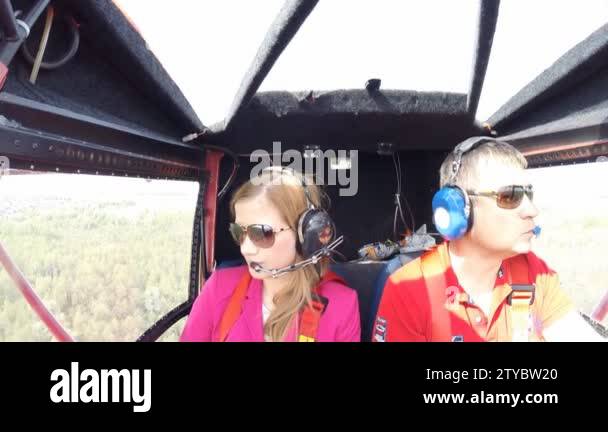 The pilot and passenger, small aircraft. Panoramic flight. The camera ...