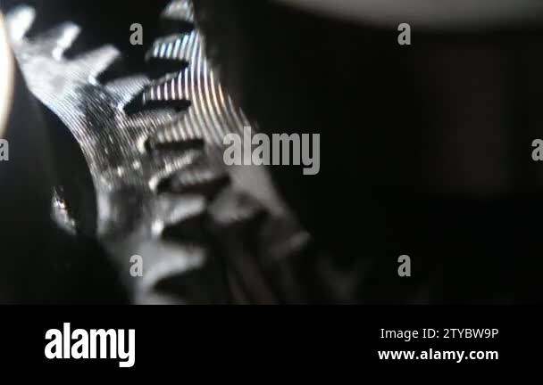 Moving teeth of two broad cogwheels working in a modern car ...
