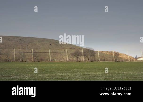 Garbage dump, landfill of municipal waste with protective net on steel ...