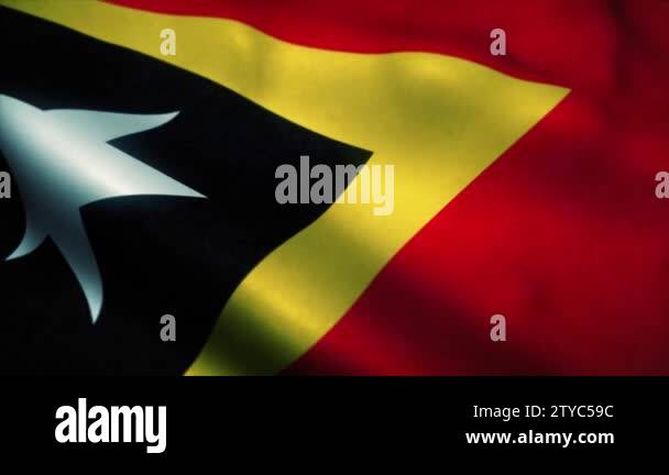East Timor flag waving in the wind. National flag of East Timor. Sign ...
