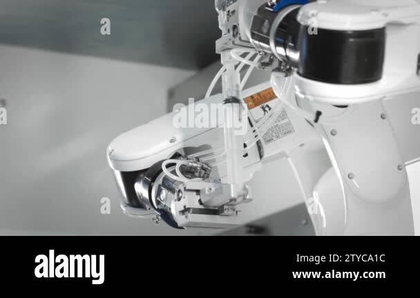 The innovative arms of a robotic arm make an injection of chemotherapy for a cancer patient. New ...