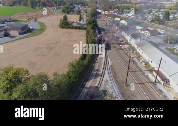 Aerial View of multiple antique restored steam engines in a train yard ...