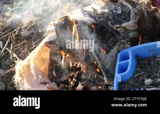 burning plastic waste in natural environment, environmental pollution ...