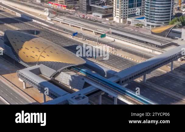 Futuristic building of Dubai metro and tram station and luxury ...