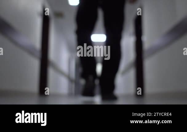 Businessman walking in the corridor of an business center. Bottom view ...