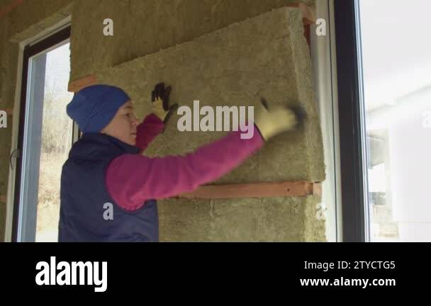 Young woman fitting insulation Stock Videos & Footage - HD and 4K Video ...