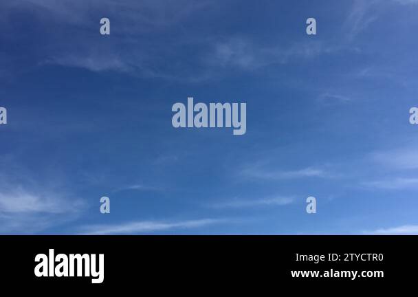 White clouds disappear in the hot sun on blue sky. Loop features time ...