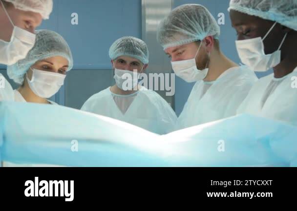 The senior surgeon in the operating room, where the patient is waiting ...