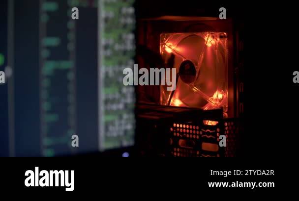 Computer with maps and data on multiple display screens in a dark room ...