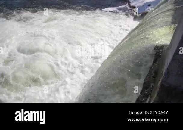 Spillway from the pipe, the dam on the river. Environmental problems of ...