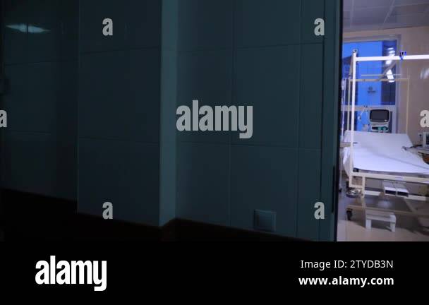 Fully-equipped hospital ward with empty bed. Burn clinic background ...