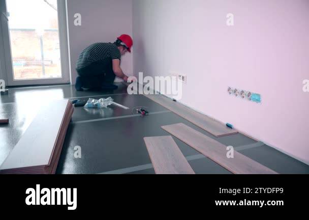 Man laying laminate flooring Stock Videos & Footage - HD and 4K Video ...