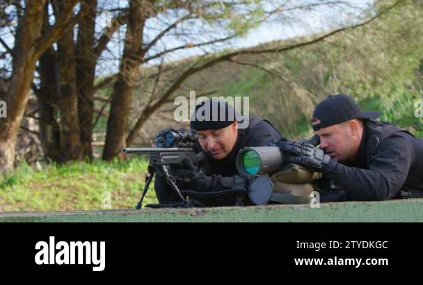 Front view of caucasian military soldiers looking through binoculars ...
