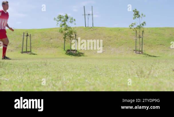 Low angle side view of a team of Caucasian male football players ...
