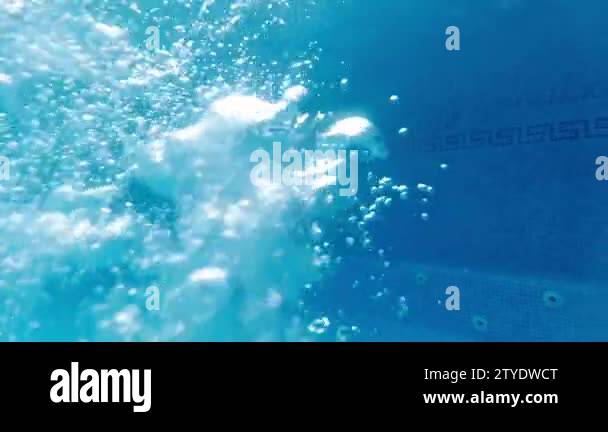 Slow motion underwater video of air bubbles rising and floating up in ...