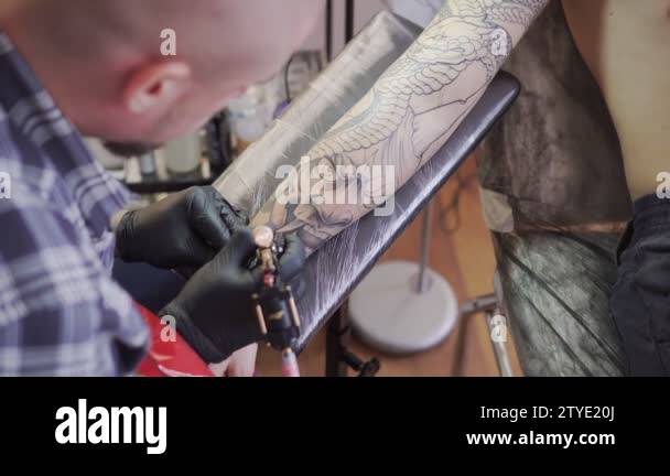 Tattoo parlor artist tattooing Stock Videos & Footage - HD and 4K Video ...