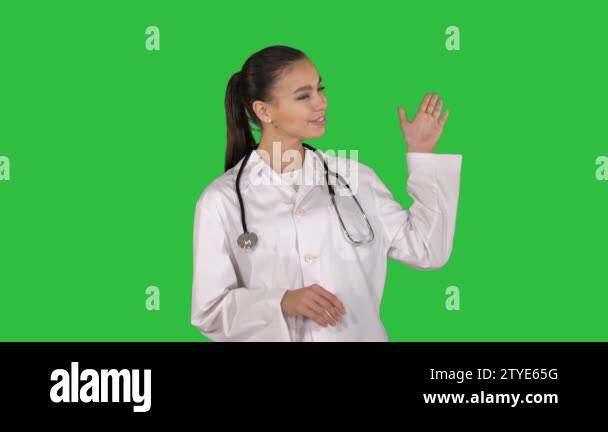 Female doctor showing something with hands extended Presentation on a ...