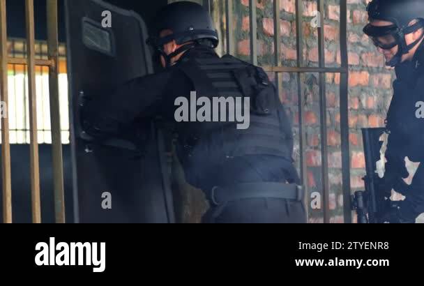 Side view of caucasian soldiers conduct military exercise at military ...