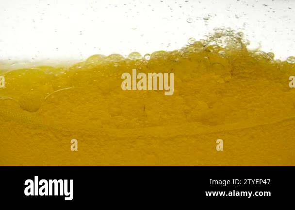 Close-up view of olive oil for food is mixed with water. Different ...