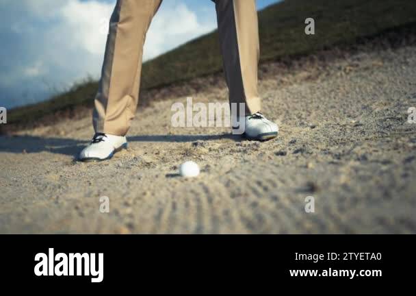 Professional Male Golfing walking with club on golf course for swing to ...