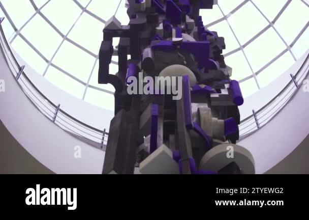 Modern architectural art form inside high rise building with glass ...