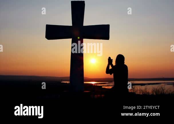 Man cross praying under Stock Videos & Footage - HD and 4K Video Clips ...