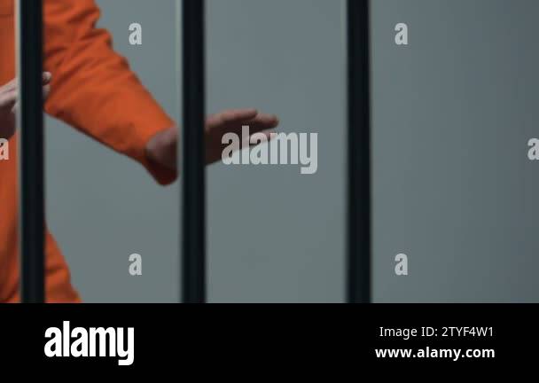 Black prisoner with knife attacking Caucasian cellmate behind prison ...