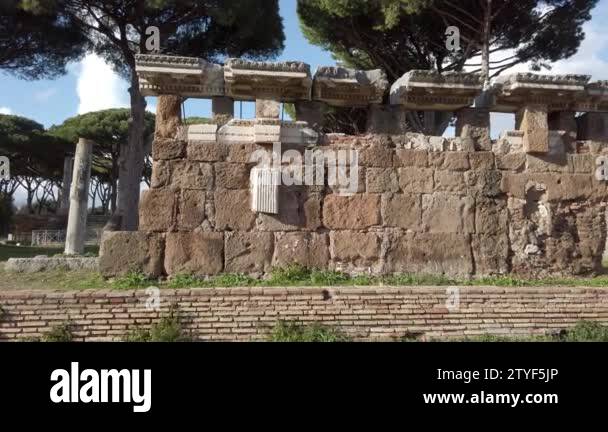 Ancient Roman archaeological excavations of Ostia Antica, pan right ...