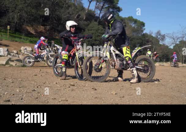 older men on motorcycles during motorcycle trial. outdoor activities ...