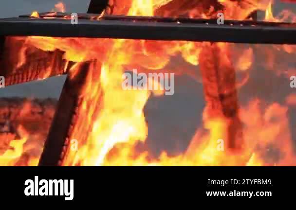 Home style video. No sound. Extreme close-up video of a burning picnic ...