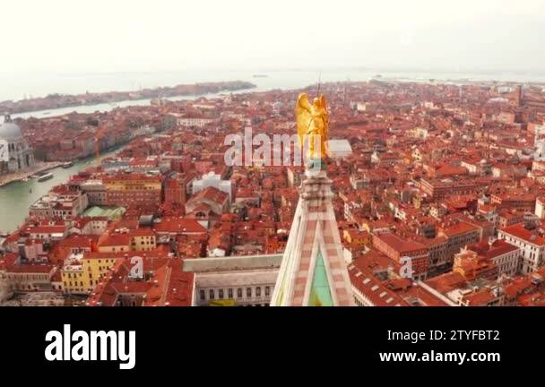golden statue of angel on top of clock tower in st marks square Stock ...