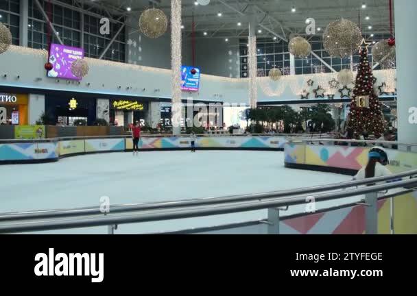 Coach with kids on the ice rink in shopping centre Stock Video Footage ...