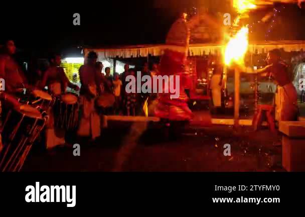 Theyyam perform with fire during temple festival in Kerala, India Stock ...