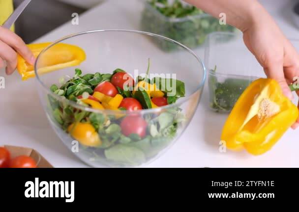 Salad preparation process. Process of mixing fresh salad. Shot Slow ...