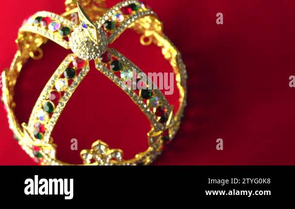 Gold crown with luxury color jewels and diamonds, view from above. With ...