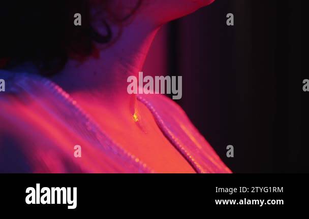 Scared sad lonely woman in the dark crying,tears dripping on the chest ...