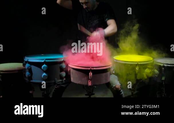 Holi powder bounces off the drum in the form of a shock wave, Close up ...