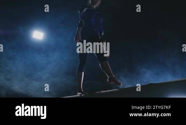 Close-up of the foot of a girl professional gymnast performs a jump ...