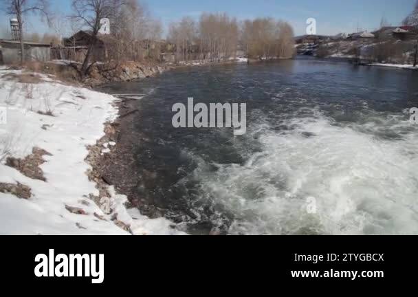 Spillway from the pipe, the dam on the river. Environmental problems of ...