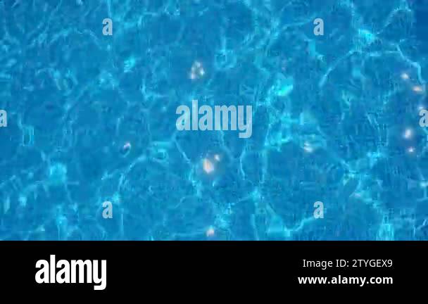 Water surface texture, clean swimming pool ripples top view, sun shine ...
