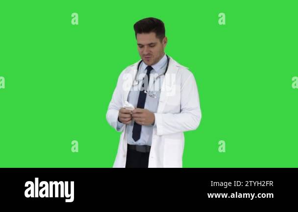 Doctor presenting nasal spray or some other medicine on a Green Screen ...