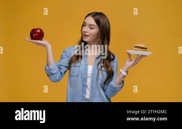 Girl holding food Stock Videos & Footage - HD and 4K Video Clips - Alamy