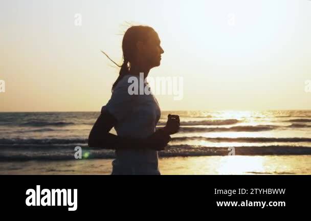 Woman jogging on beach fit Stock Videos & Footage - HD and 4K Video ...