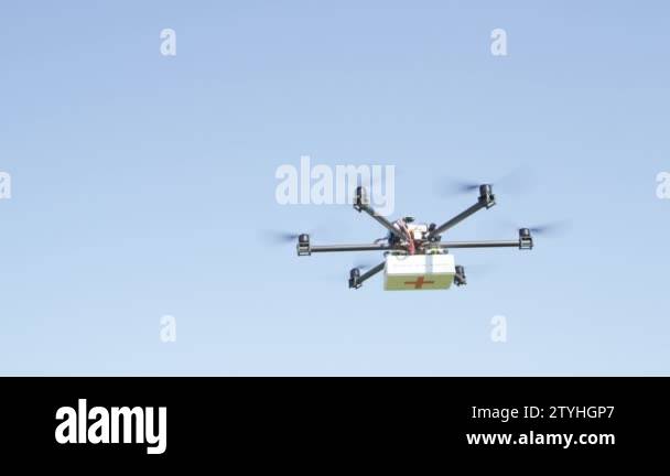 CLOSE UP: UAV Drone delivery. Multicopter rising and flying with first ...